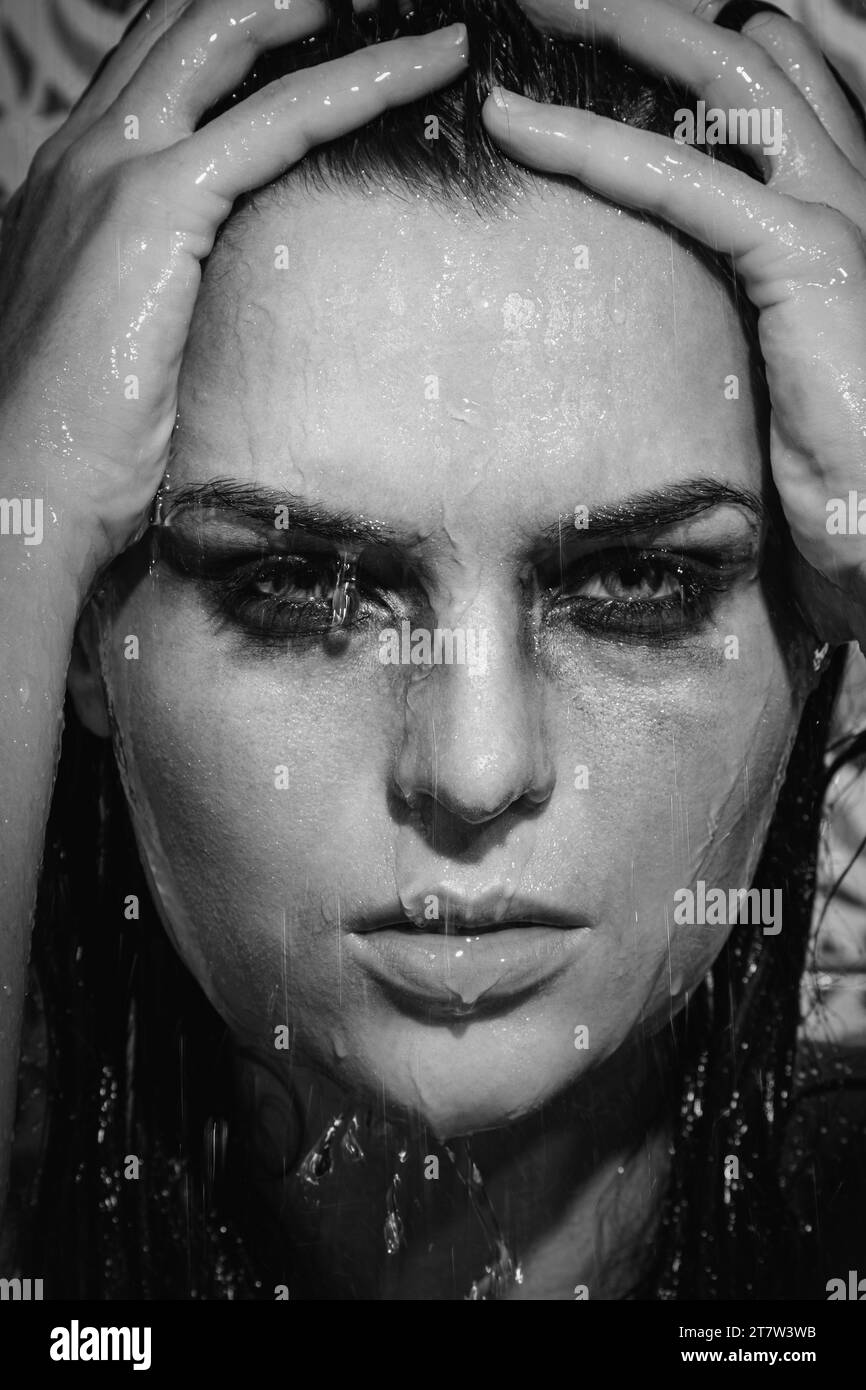 Sad and wet woman with smudged makeup on her face under the shower Stock Photo - Alamy
