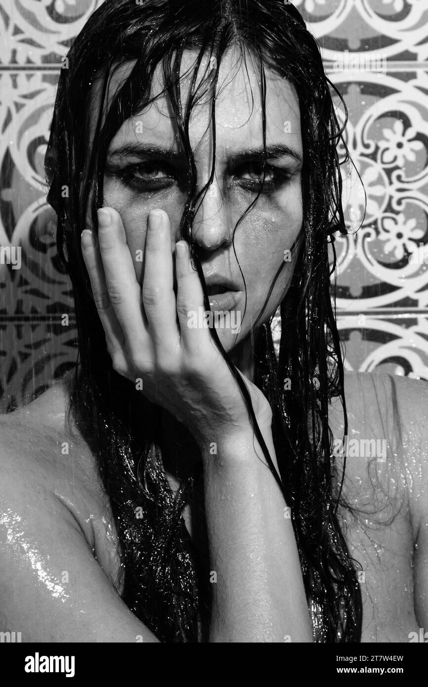 Sad and wet woman with smudged makeup on her face under the shower Stock Photo - Alamy