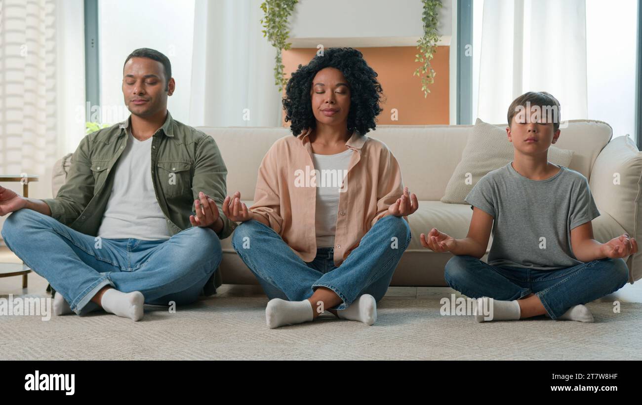 Calm peaceful multiracial family African American parents teach ...