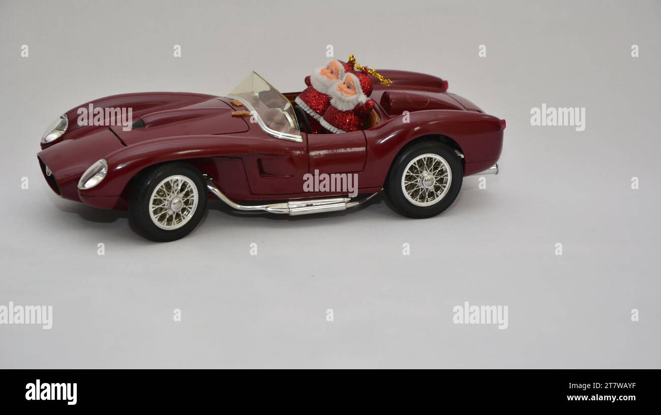 Santa Claus riding a sports car in red color before Christmas arrives ...