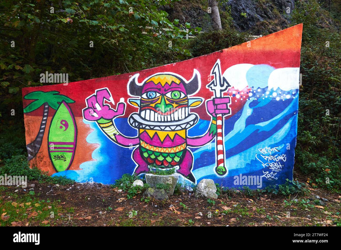The vivid artistry of beach side graffiti in Laga, Ibarrangelu. A burst ...