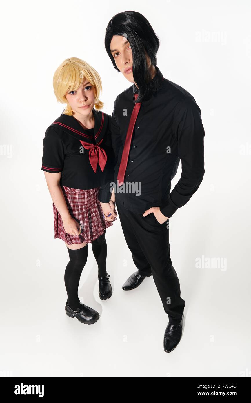wide angle view of anime style students in wigs and dark uniform ...