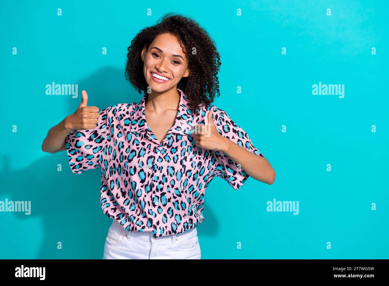 Photo of satisfied positive girl wear stylish clothes two hands thumbs ...