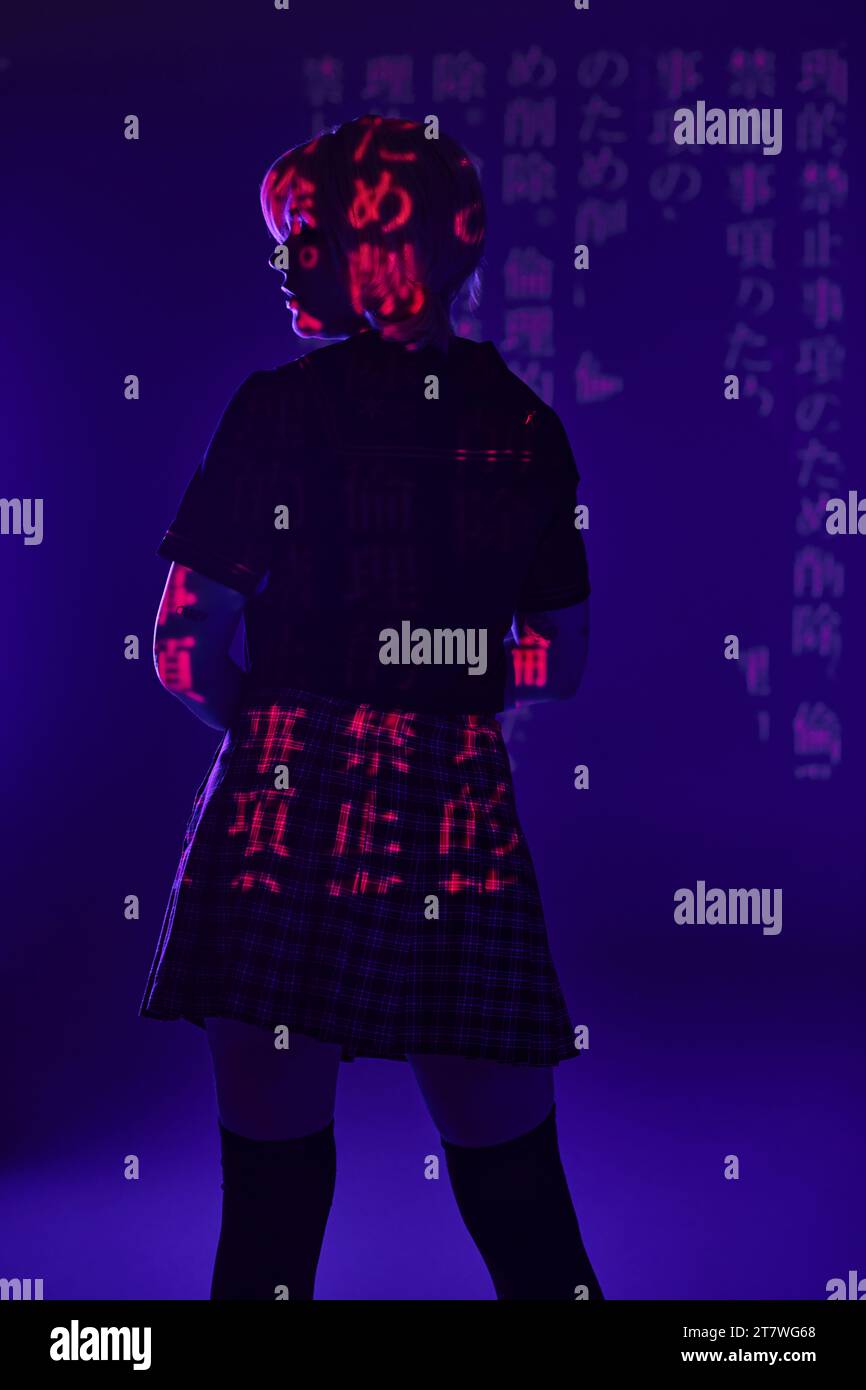 back view of anime woman in school uniform in hieroglyphs projection on ...