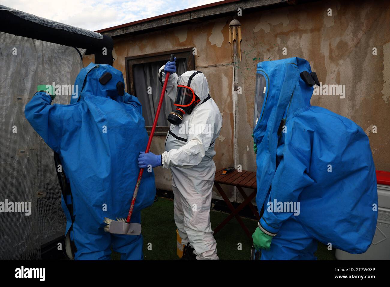 People wear Personal protective equipment (PPE) with gas mask for ...