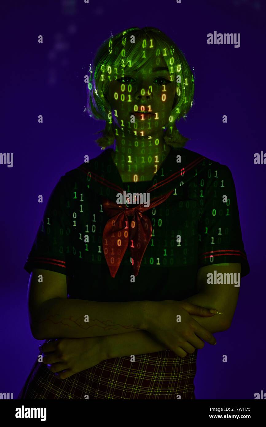 young female student in neon programming code projection on blue ...