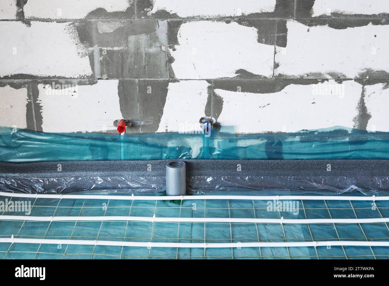 Heating and water pipes installation on construction site Stock Photo ...