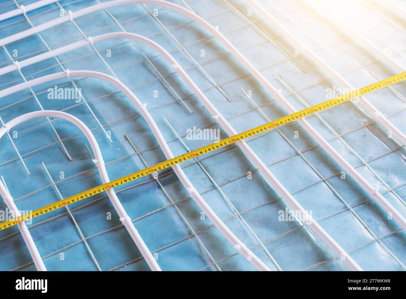 Underfloor heating pipes installation on construction site Stock Photo ...