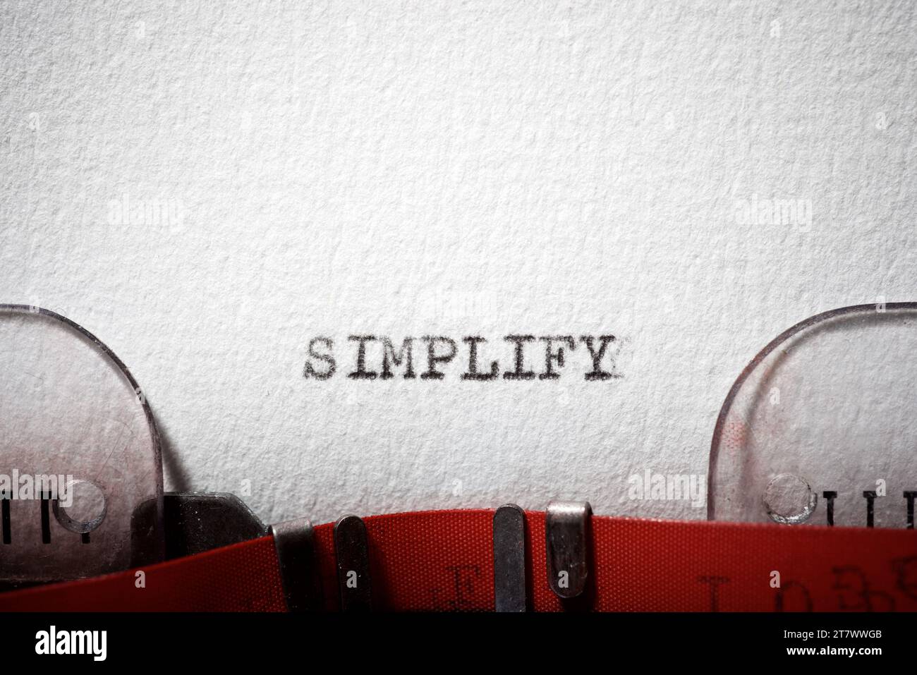 Simplify word written with a typewriter Stock Photo - Alamy