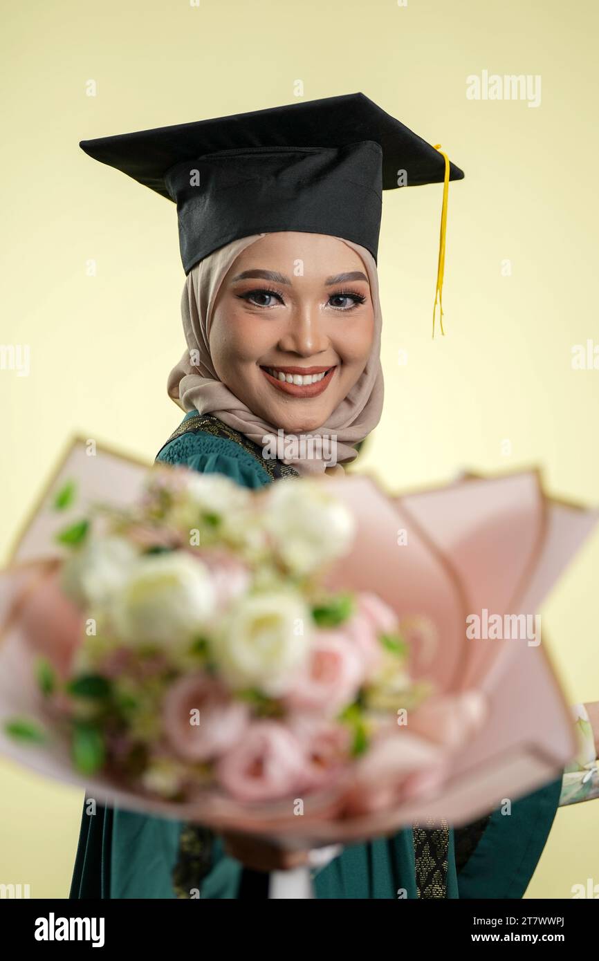 Female muslim lady posing in graduation attire Stock Photo - Alamy