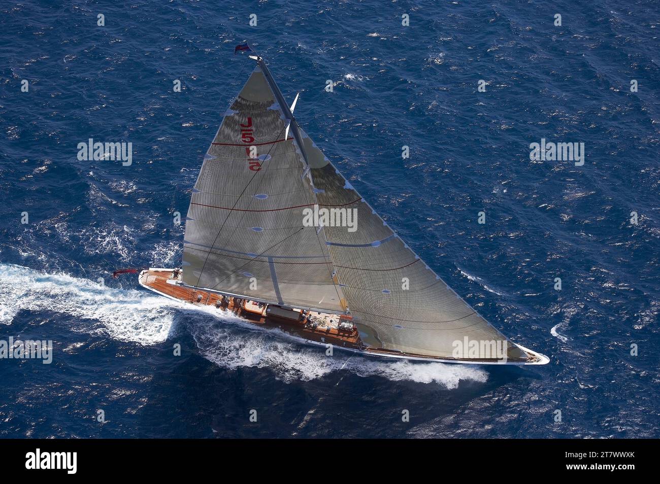 Aerial photo of J class RANGER under full sail racing in a choppy sea ...