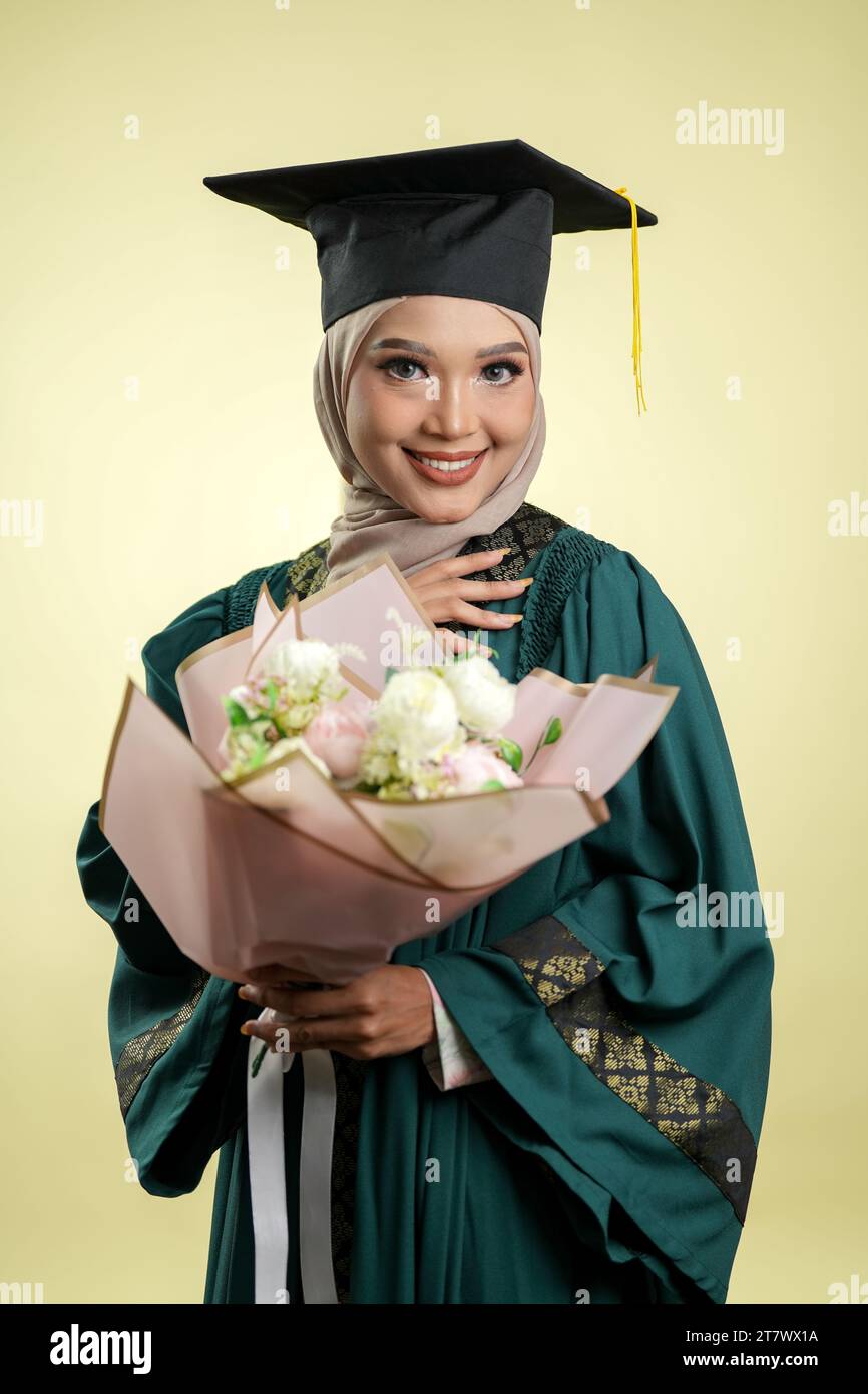 Female muslim lady posing in graduation attire Stock Photo - Alamy
