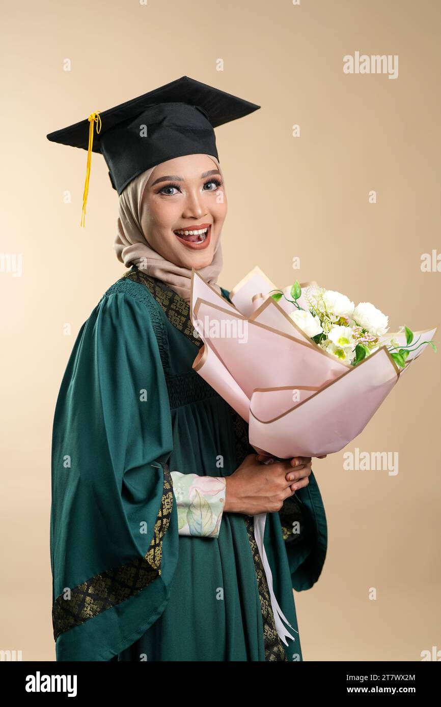 Female muslim lady posing in graduation attire Stock Photo - Alamy