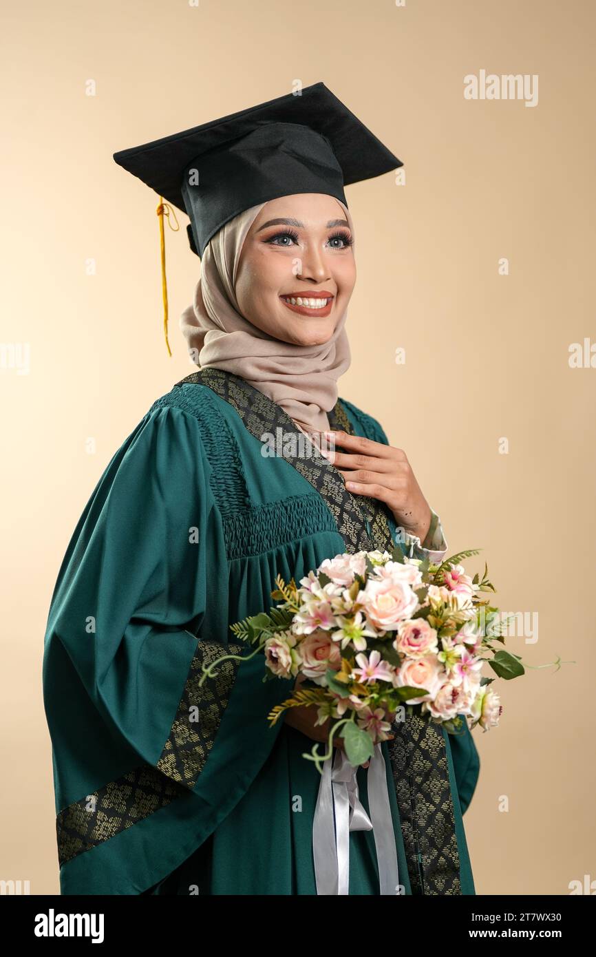Female muslim lady posing in graduation attire Stock Photo - Alamy
