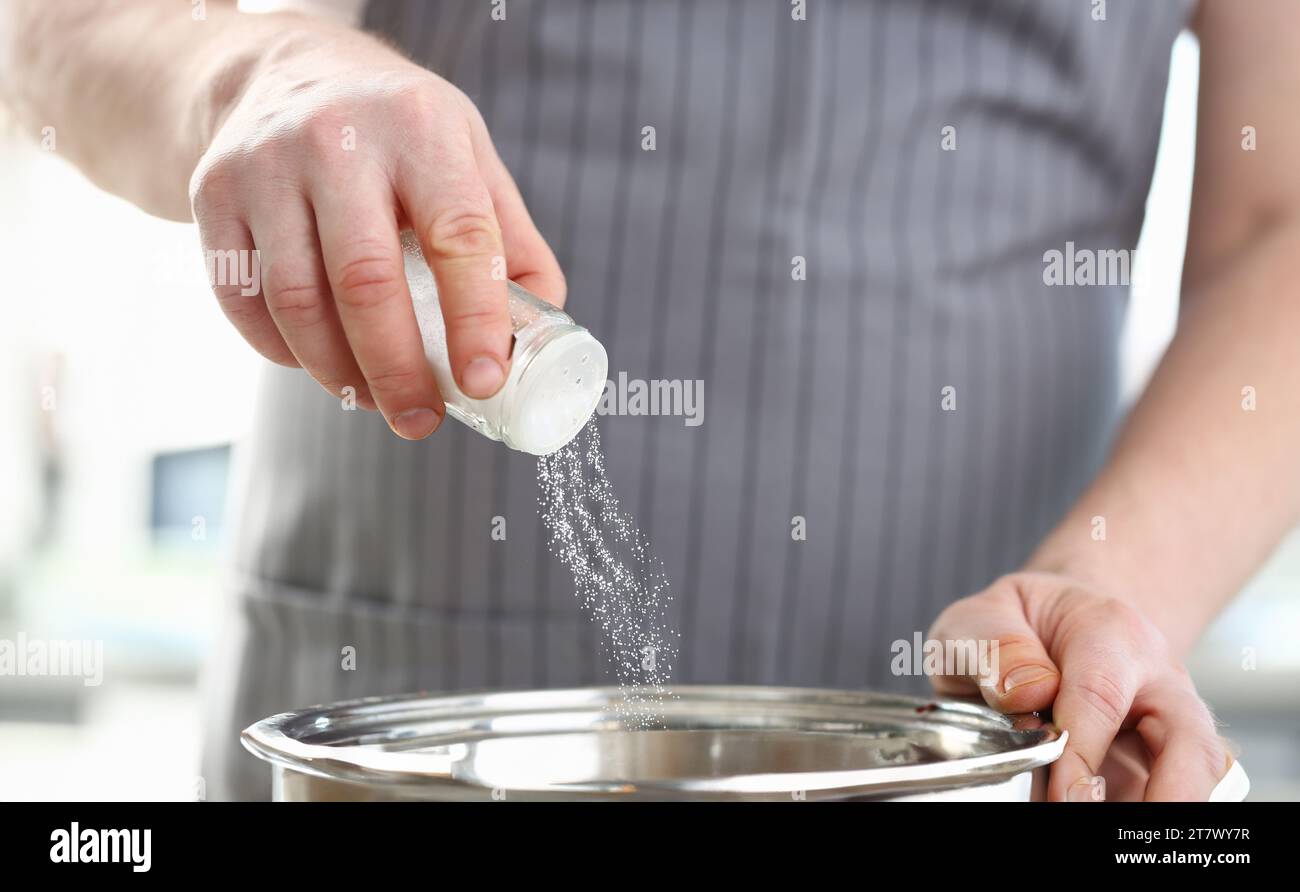 Chef Wearing Apron Adding Dish White Sea Salt Stock Photo - Alamy