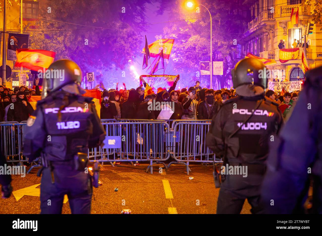 A group of protesters protest behind the security fence and the gaze of ...