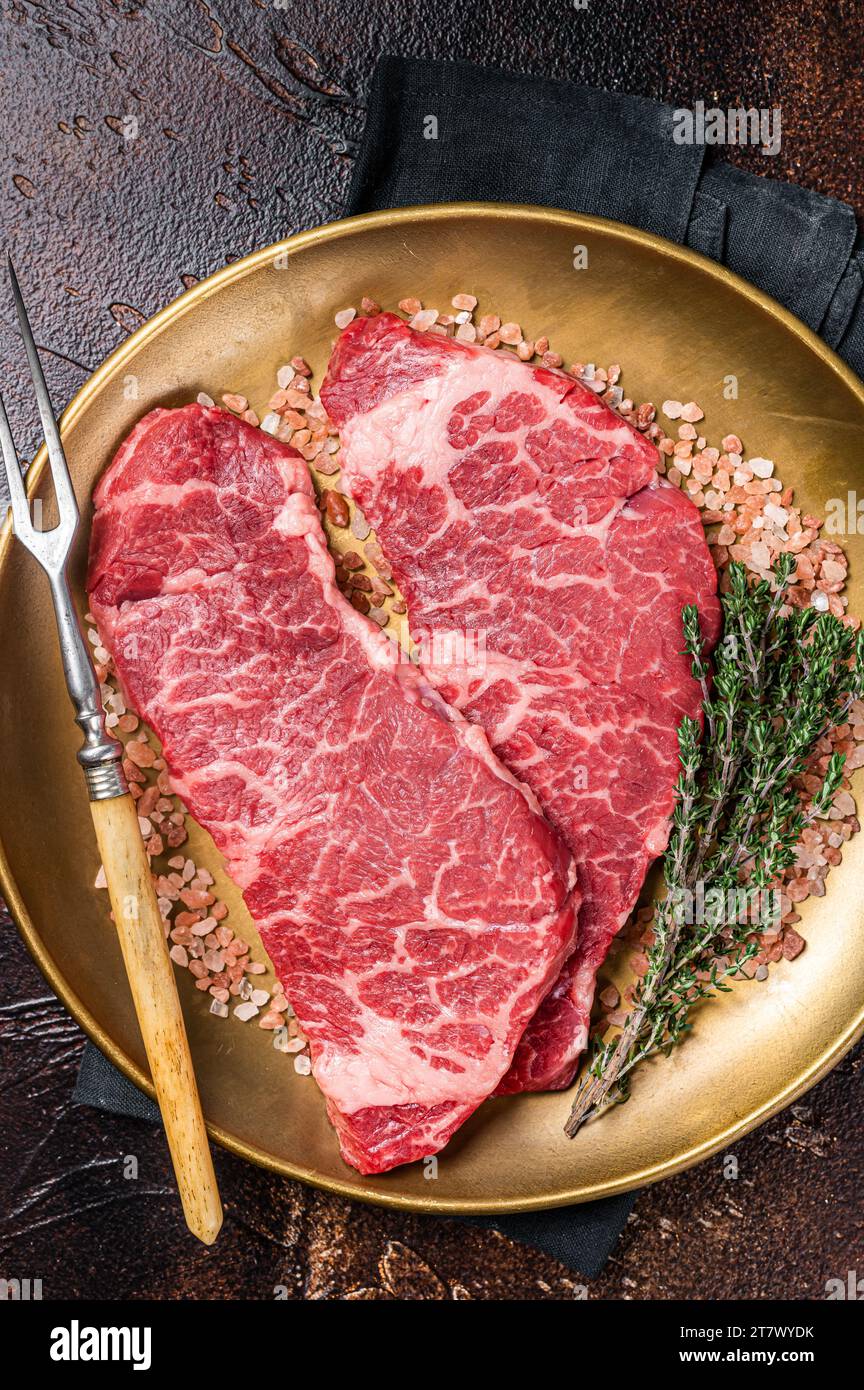 Alternative beef steak Denver, raw meat steak with herbs. Dark ...