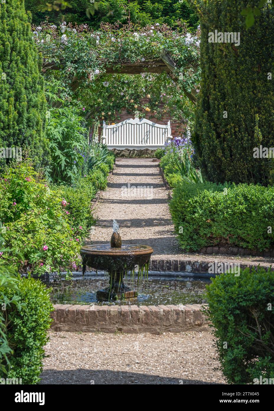 A fountain and pond on the central walkway across the Rose Garden at ...