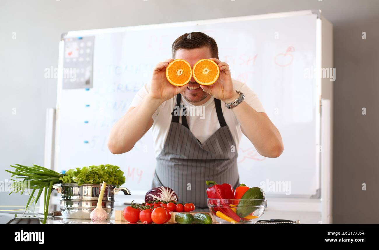 Chef Vlogger Showing Comic Orange Citrus Eye Stock Photo - Alamy