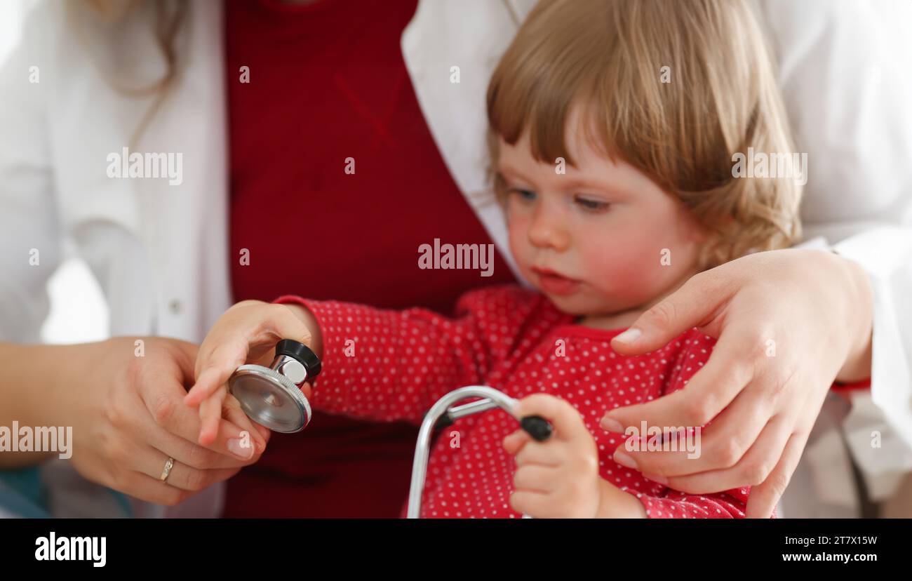 Little child with stethoscope at doctor Stock Photo - Alamy