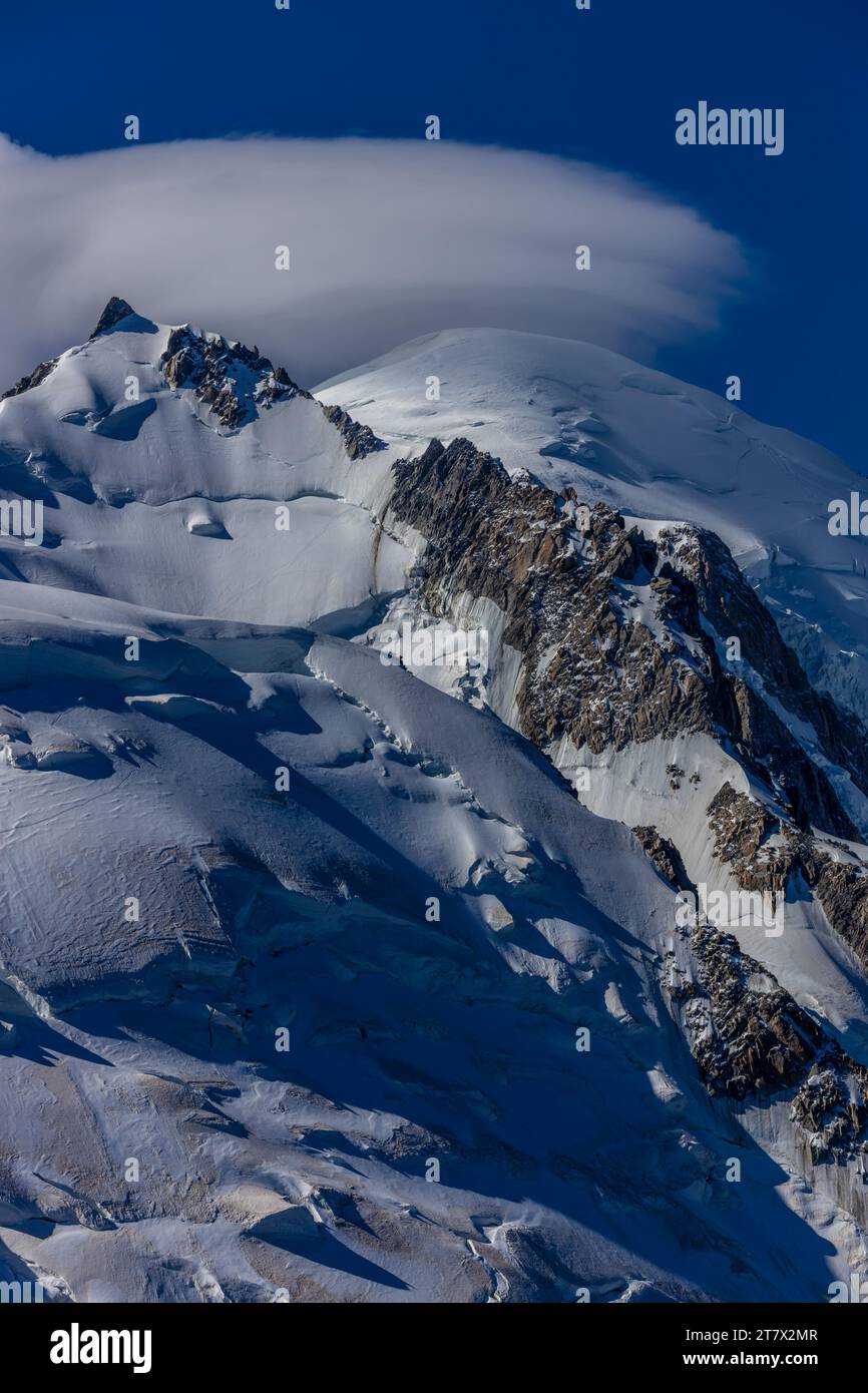 Alps snowcapped mountains in Chamonix, view from Aiguille du Midi peak summit. Alpine snow and ...