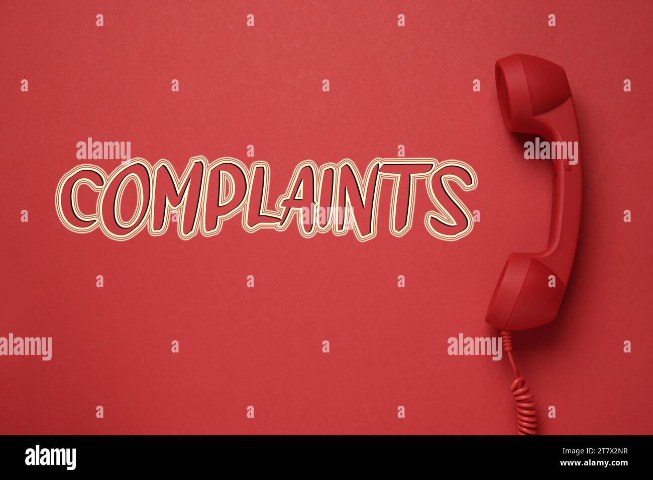Corded telephone handset and word complaints on red background, top view Stock Photo - Alamy
