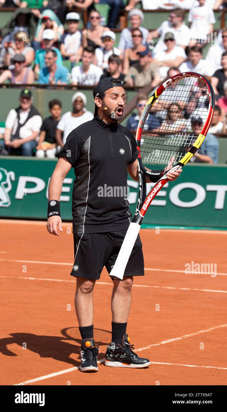 Cyril Hannouna, french tv presentator, having fun with a giant racket ...
