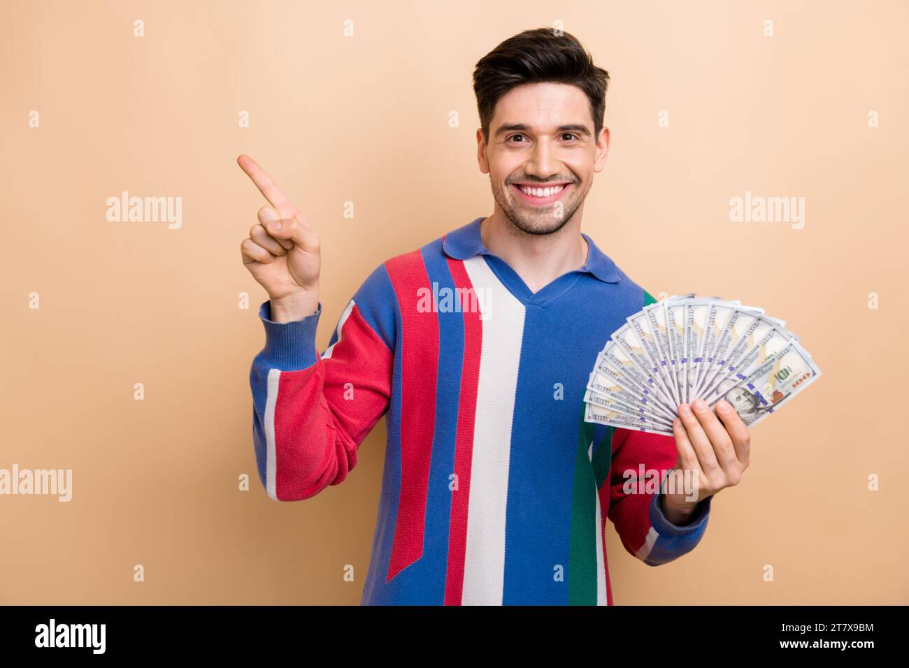 Photo of positive nice person toothy smile hold dollar bills indicate ...