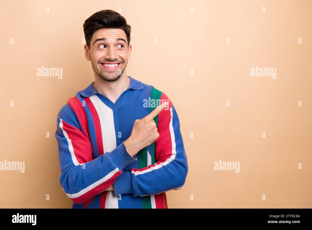 Photo of cheerful young person beaming smile look direct finger empty ...