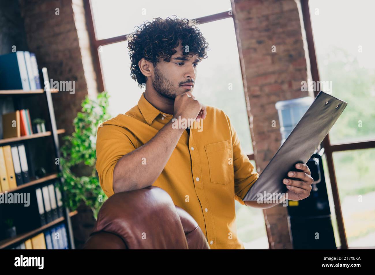 Photo portrait of handsome young guy wear yellow shirt thoughtful read ...