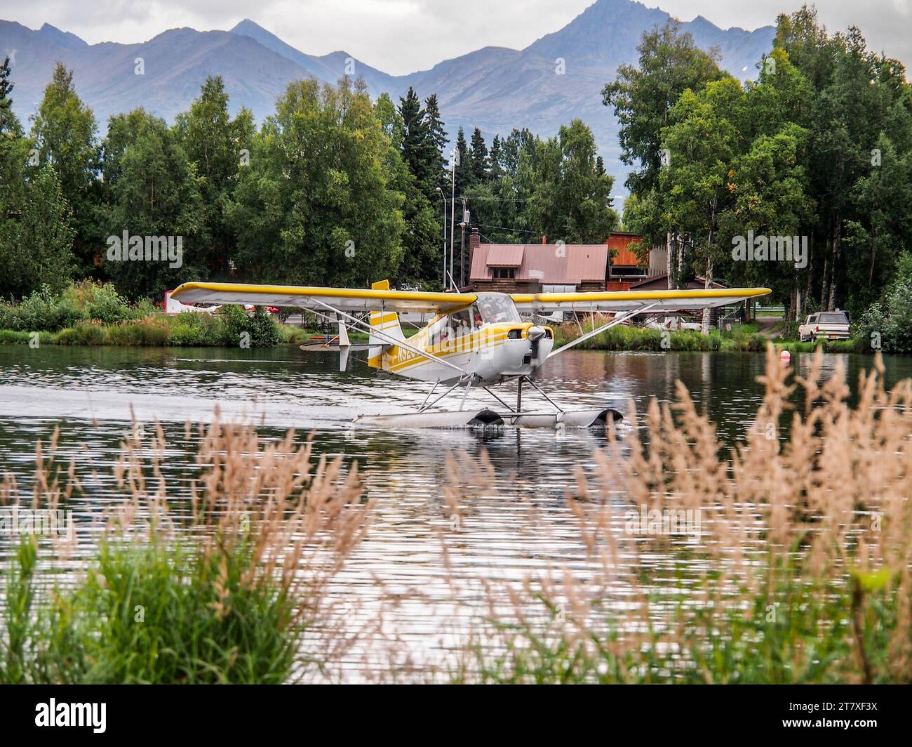 Float plane taxiing on Lake Hood in Anchorage, Alaska Stock Photo - Alamy