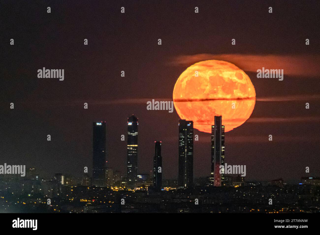 The Blue Moon, full moon at perigee, behind the Cuatro Torres ...