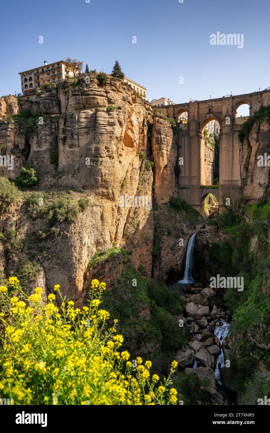 Beautiful bridge and waterfall and traditional white village of Ronda ...