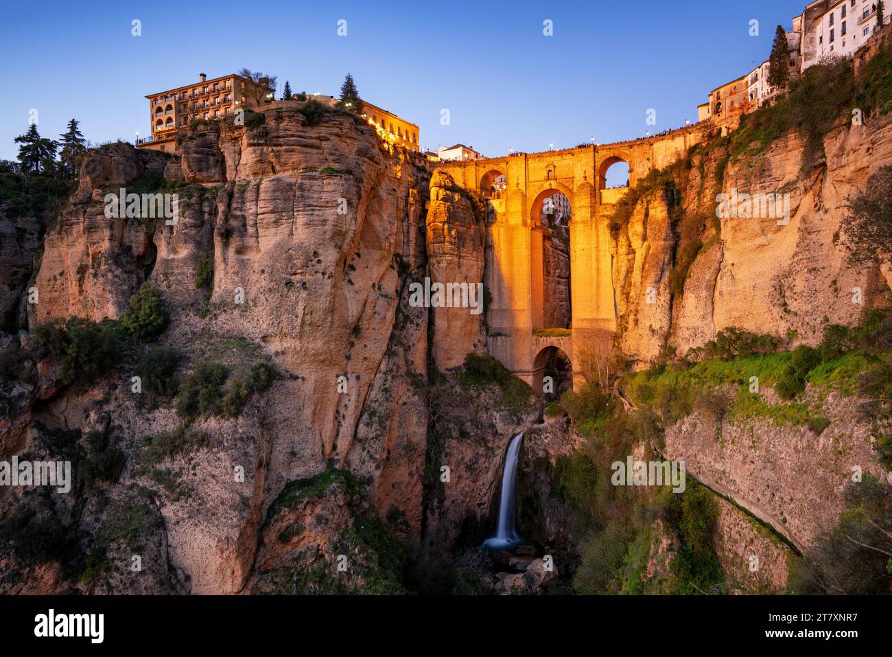 Ronda view with beautiful bridge and waterfall and traditional white ...