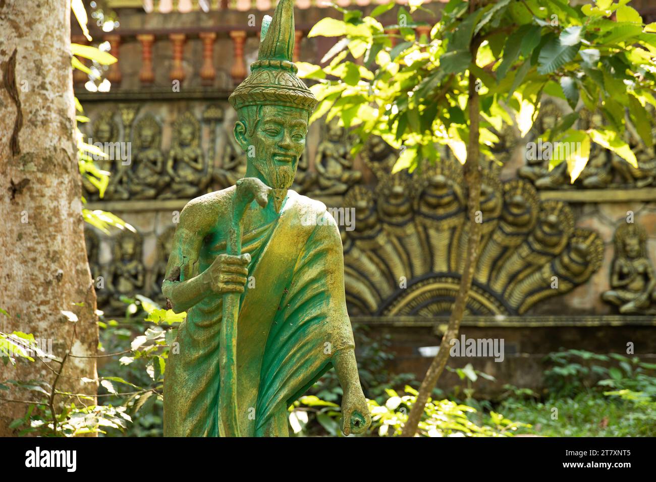 Ancient statue of wiseacre elder in Cambodia Stock Photo - Alamy