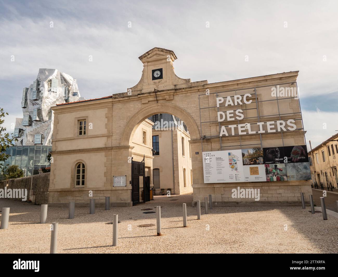Entrance to Parc Des Ateliers cultural centre with Gehry's LUMA tower ...