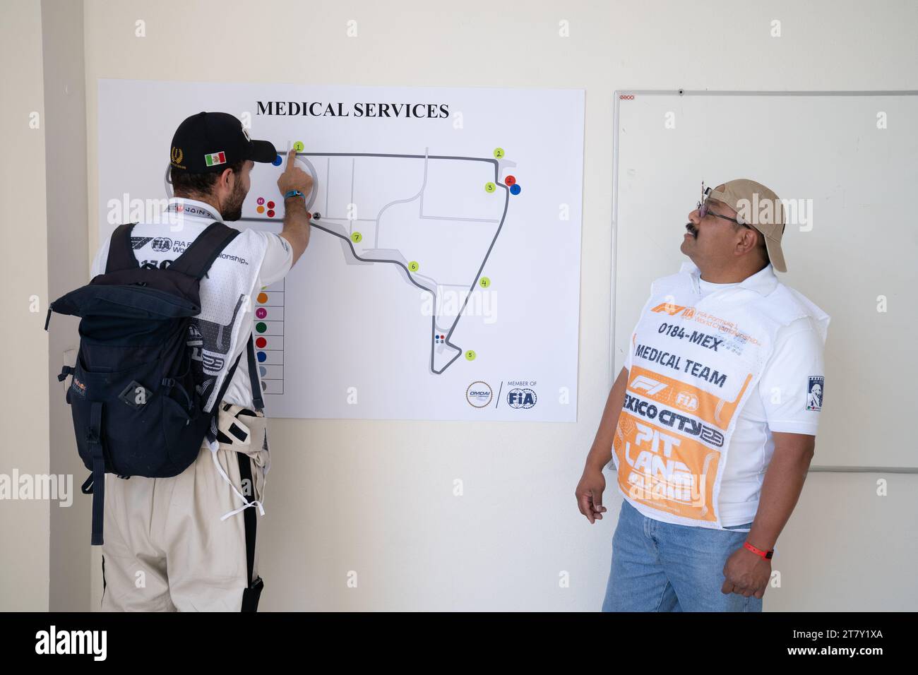 A doctor and member of the medical team discuss positions around the ...