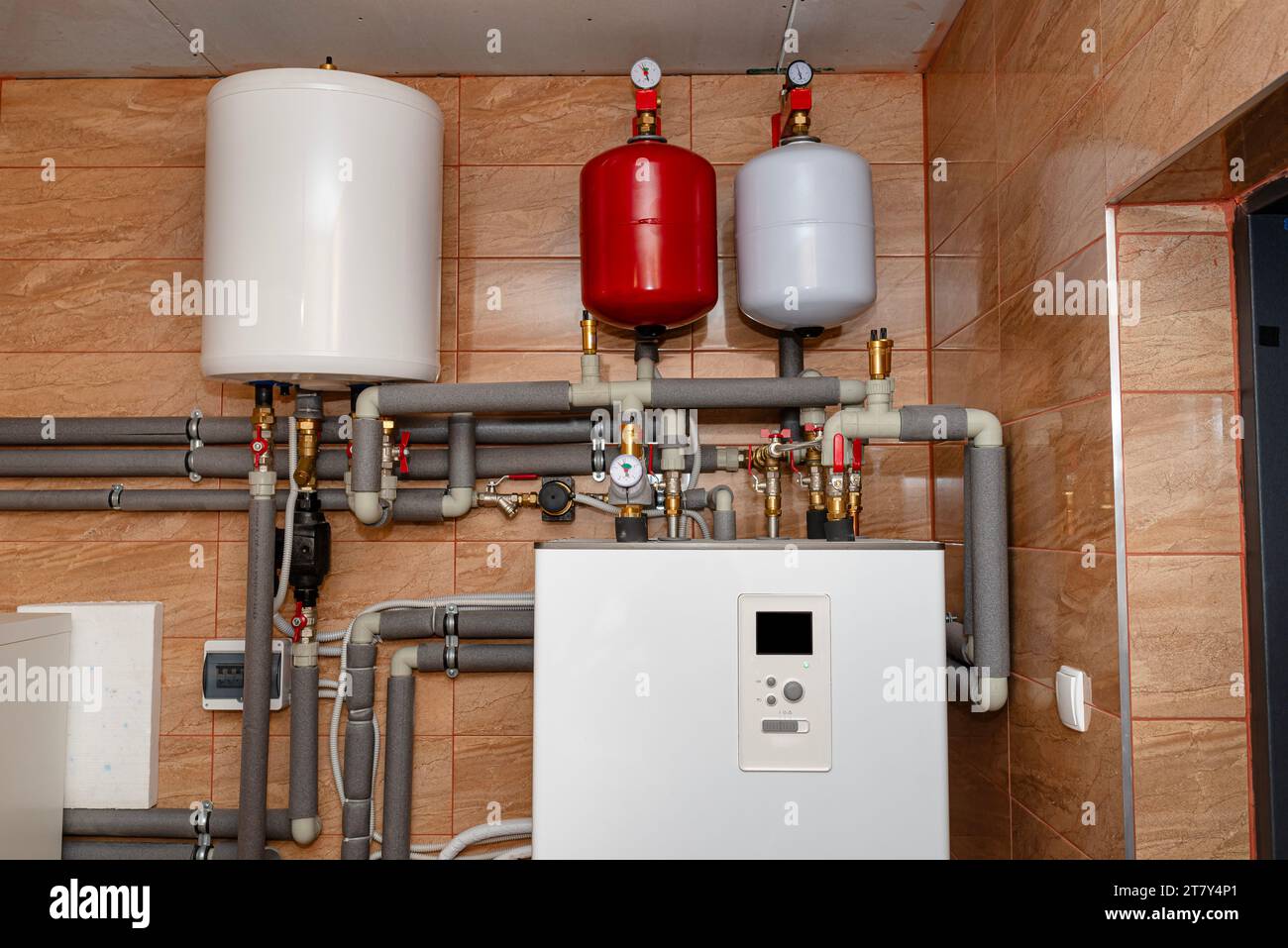 A modern air heat pump installed in the home's boiler room, visible ...