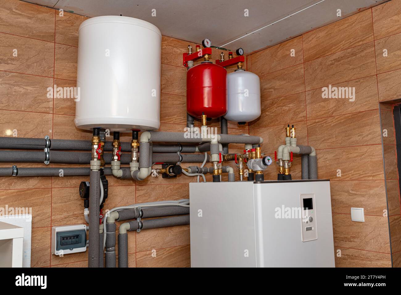 A modern air heat pump installed in the home's boiler room, visible ...