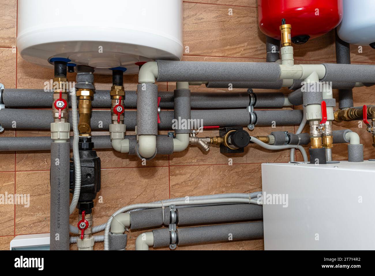 A modern air heat pump installed in the home's boiler room, visible ...