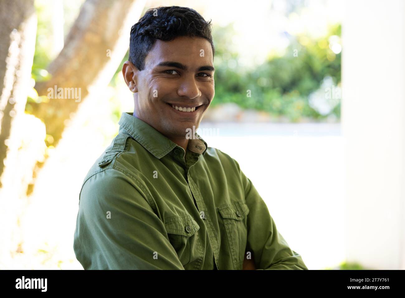 Portrait of happy biracial man standing next to window at home Stock Photo - Alamy