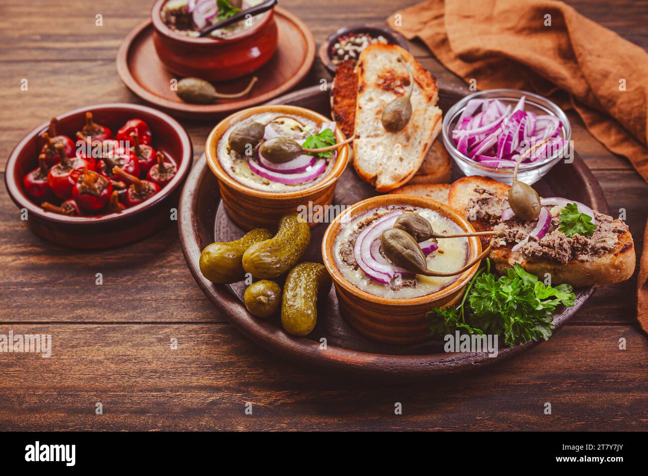 Fresh homemade chicken liver pate in ceramic bowls and appetizers on ...