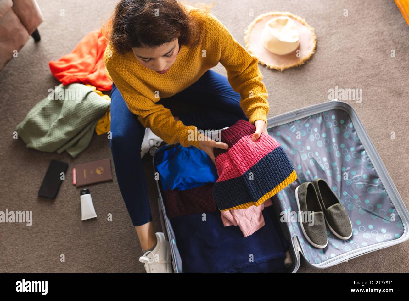 Woman packing suitcase home hi-res stock photography and images - Alamy
