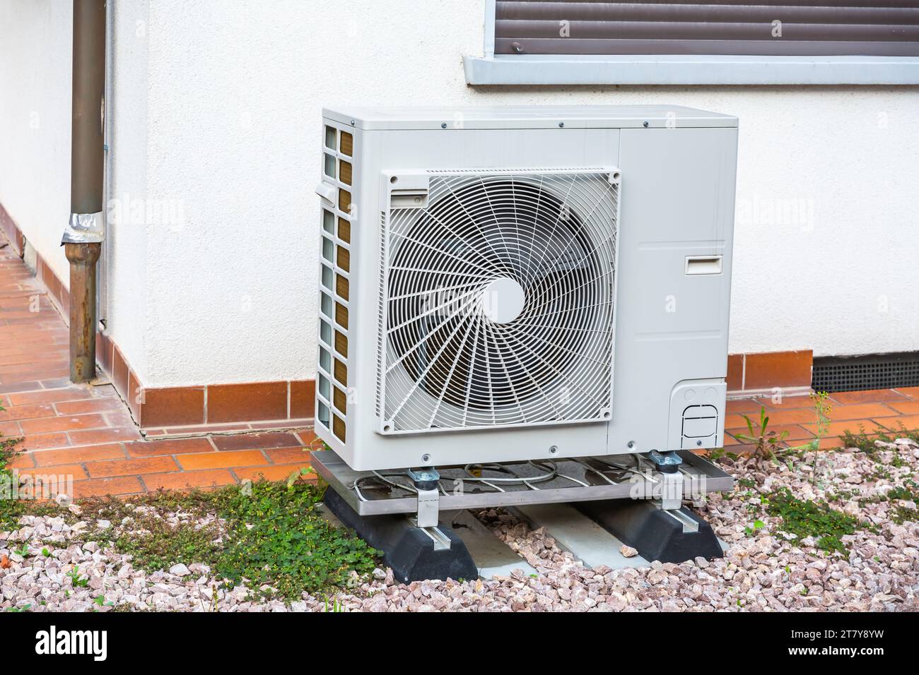 Efficient air source heat pump: modern solution for home heating and hot water Stock Photo - Alamy