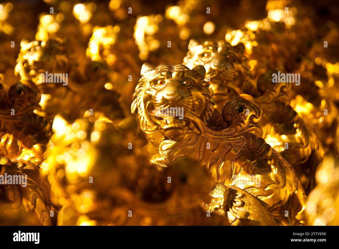 Bunch of golden lion statues for sale in a shop. Vietnam, Asia Stock ...