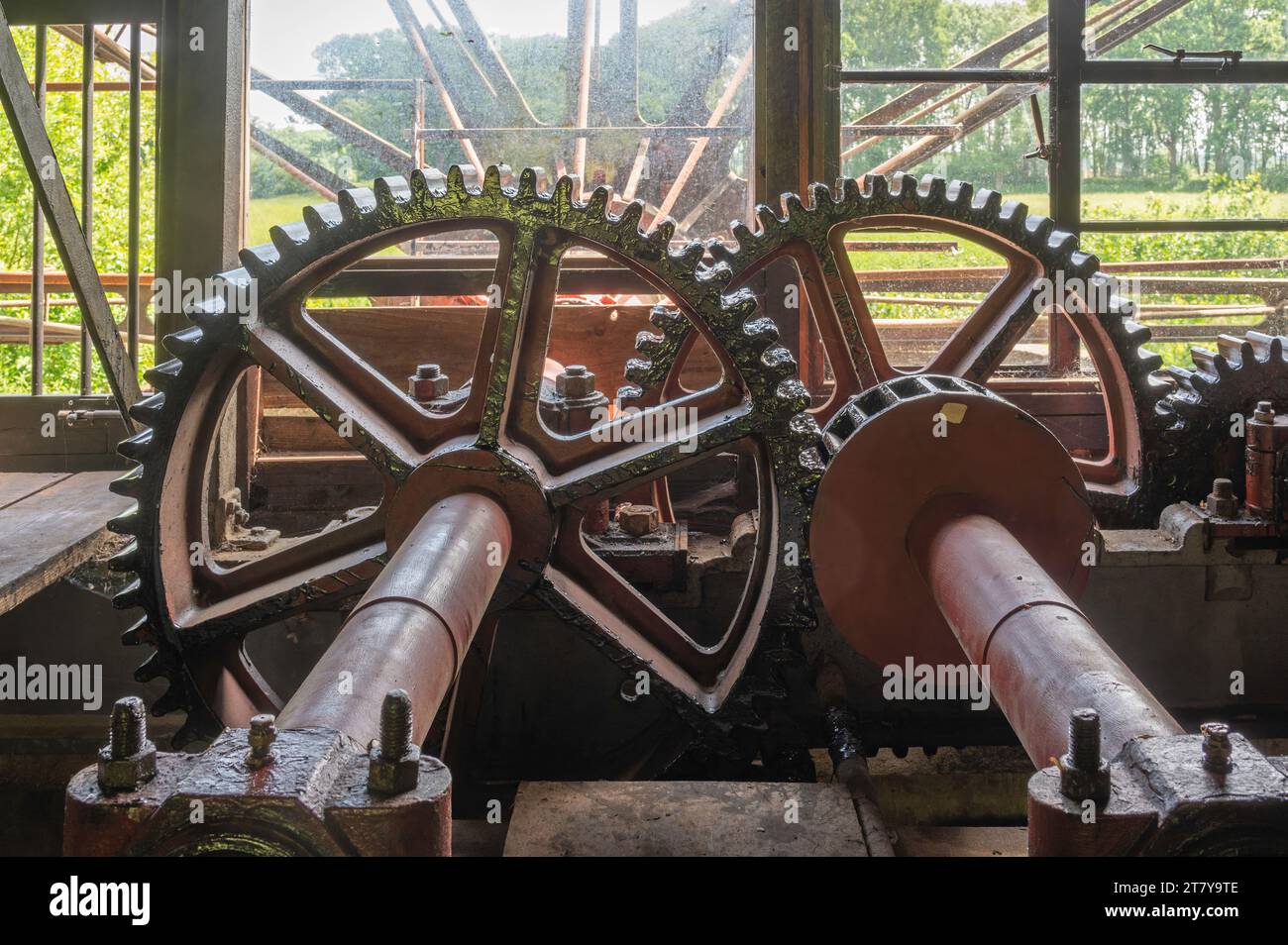 The restored and working iron waterwheel on the River Mole at Painshill ...