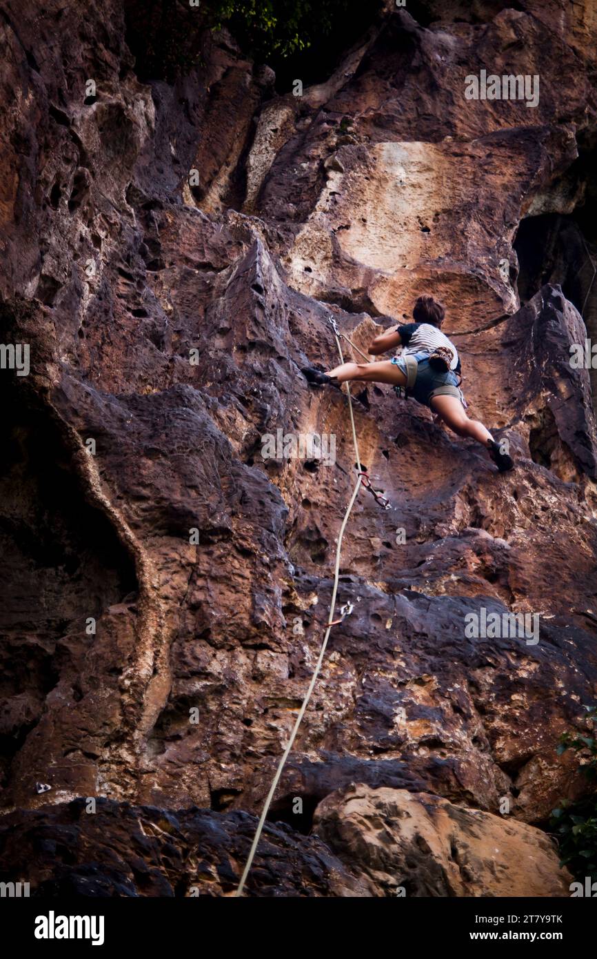 Rock climbers climbing a rock face in Quoc Oai, Vietnam Stock Photo - Alamy