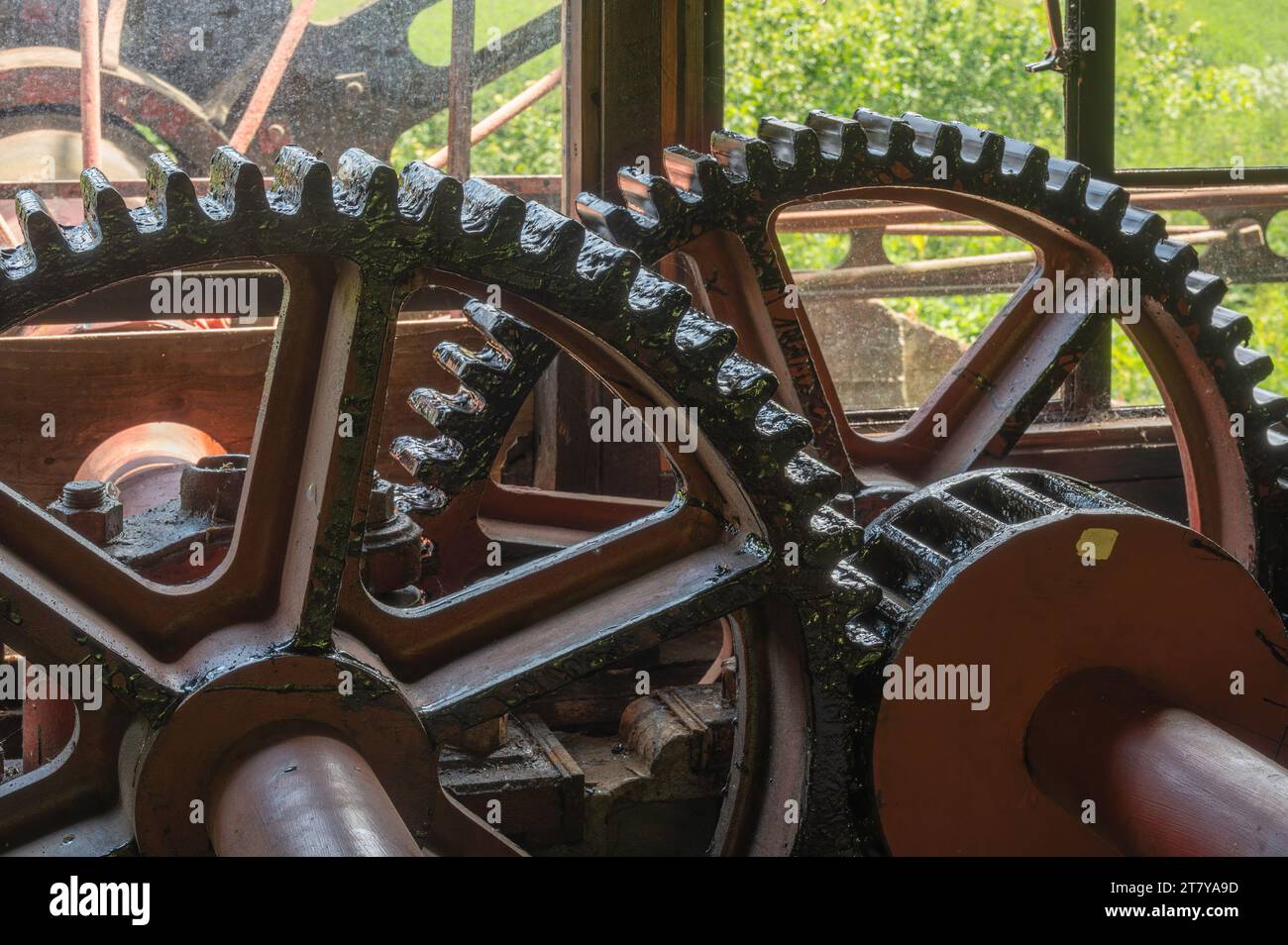 The restored and working iron waterwheel on the River Mole at Painshill ...