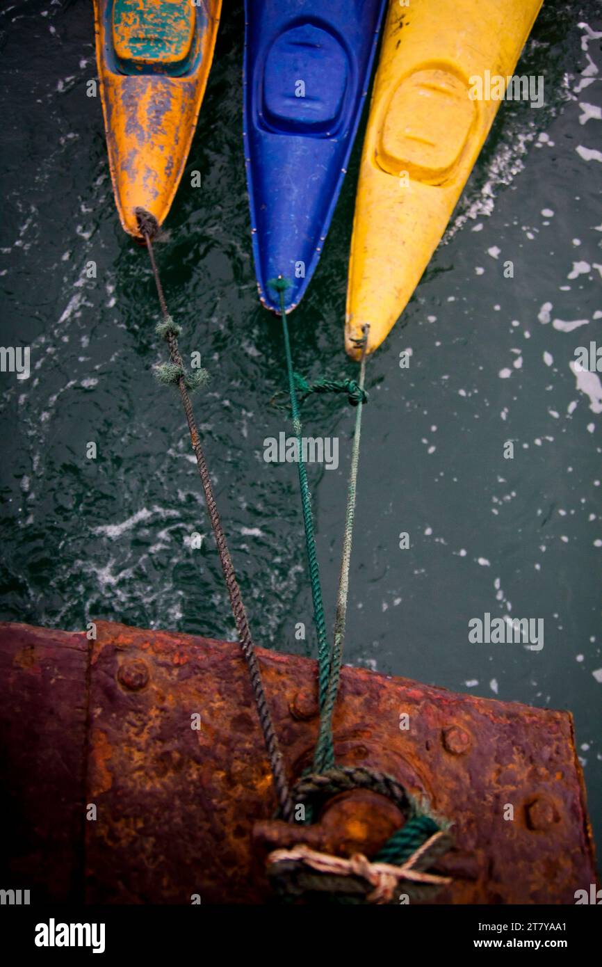 Slo Pony kayaks tethered to a boat in Halong Bay, Vietnam Stock Photo ...