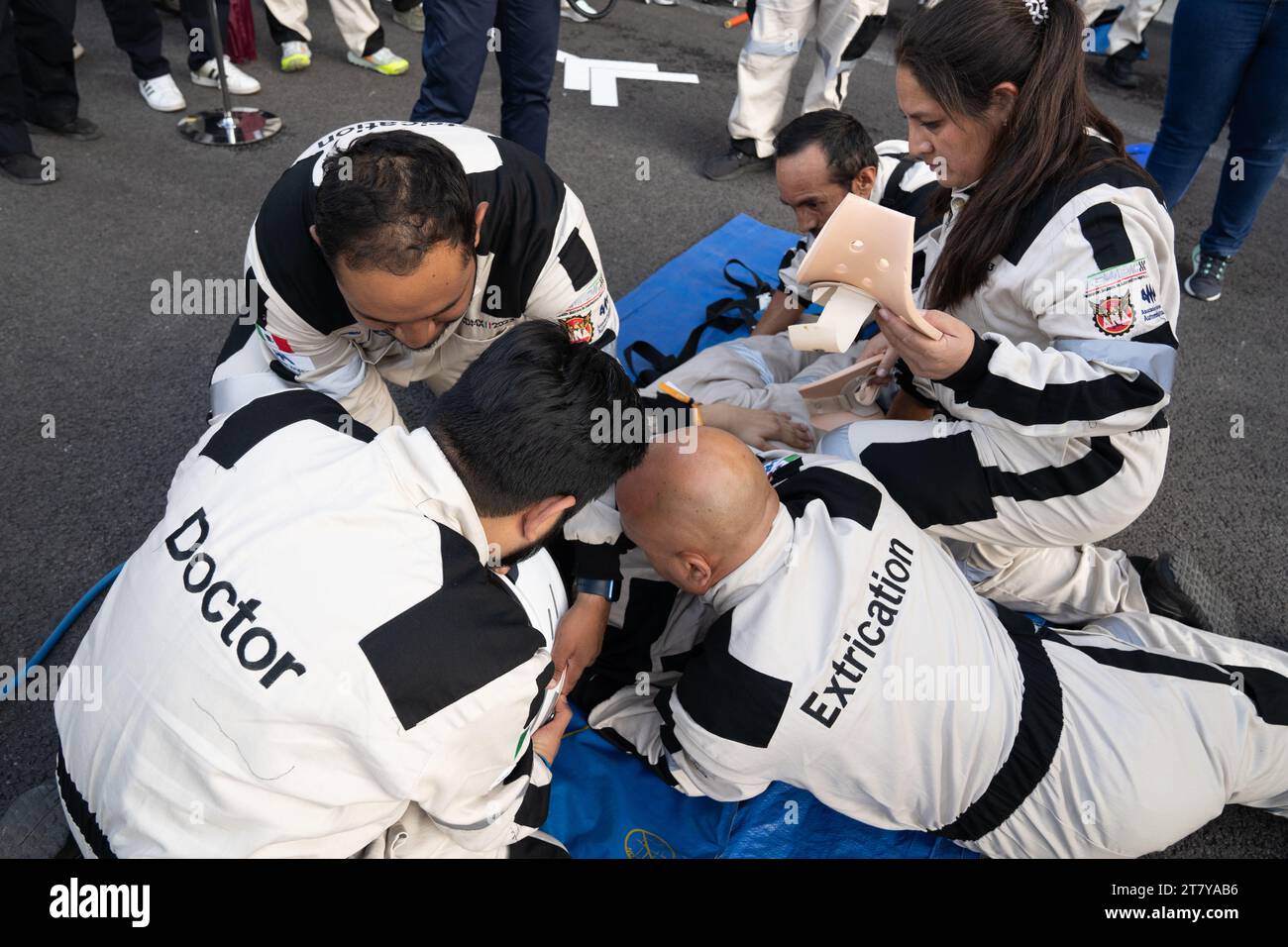 The extrication team practice removing a driver from a car in the pit lane and placing the ...